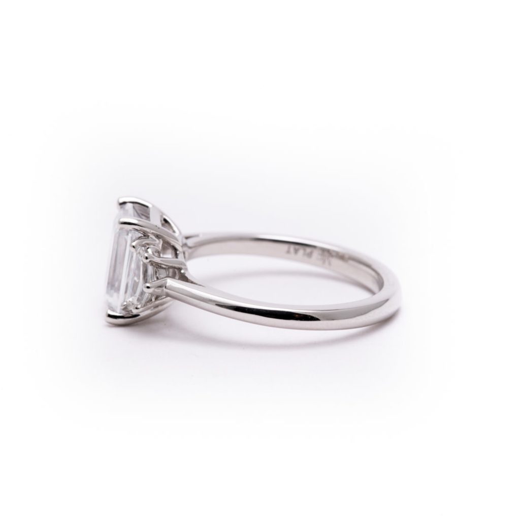 The Evelyn Emerald Cut Engagement Ring with Epaulette Side Stones - M. Flynn